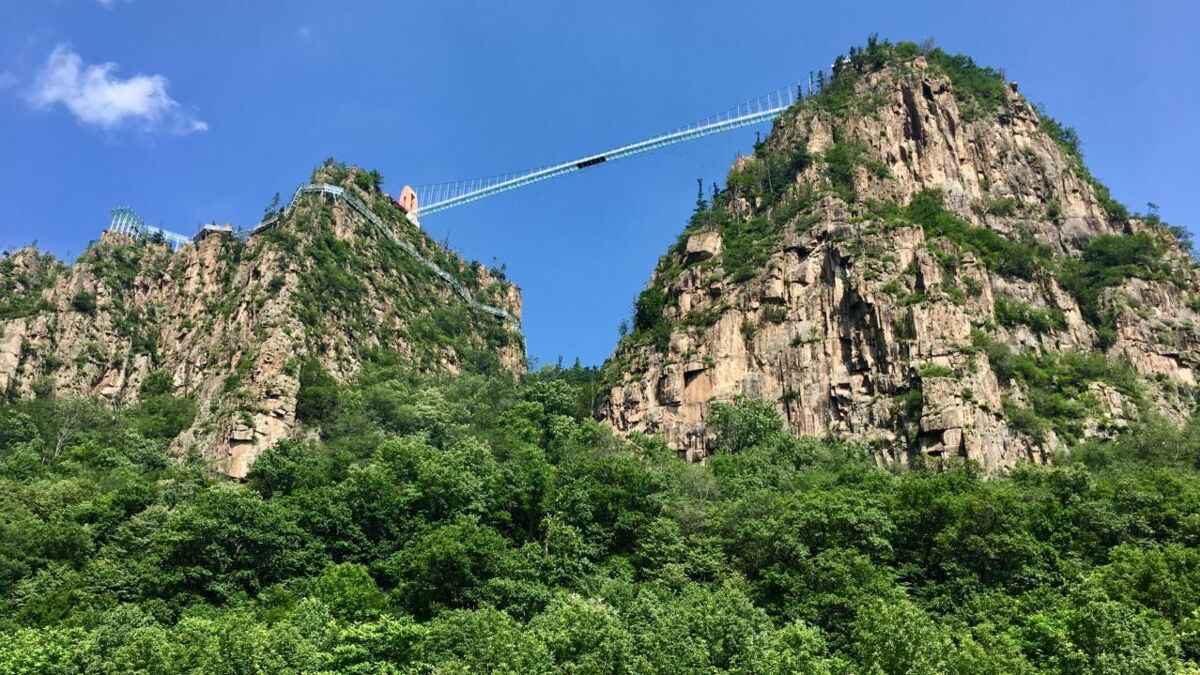 100 metres high glass bridge breaks and leaves tourist stranded at the top