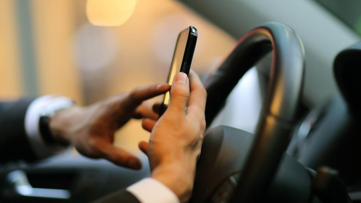 Use of handheld mobile while driving to become illegal next year