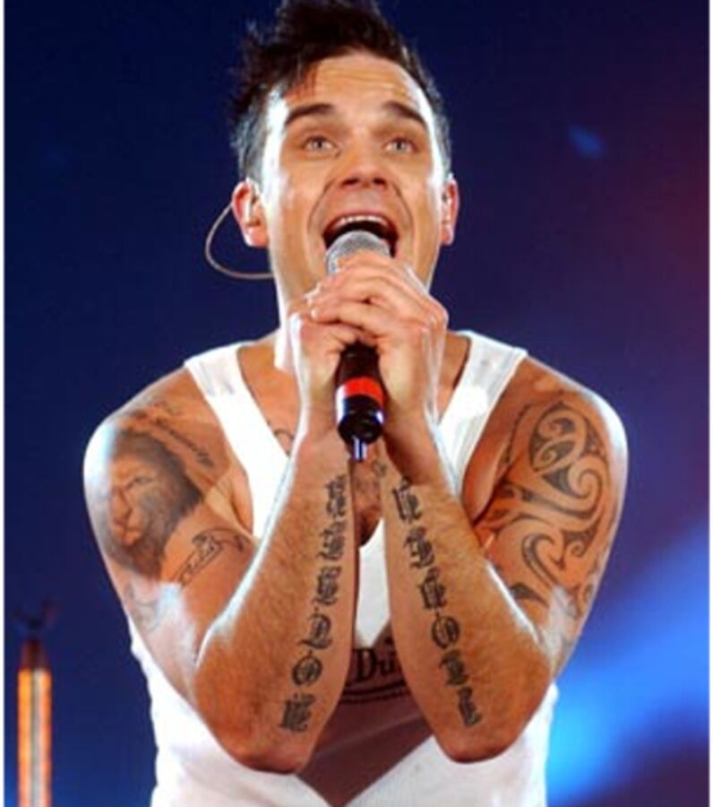 Photos : Découvrez tous les tatouages de Robbie Williams